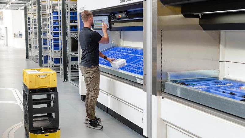 SSI LOGIMAT® Vertical Lift Module & AGV WEASEL® Lite | SSI SCHAEFER